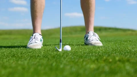 low shot of a golf player swinging the b... | Stock Video | Pond5