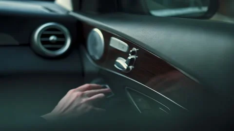 lowering the window in a luxury car with... | Stock Video | Pond5