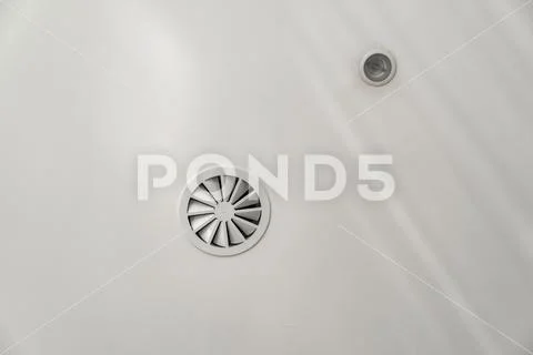 Photograph: Luminaire and diffuser fan on the white ceiling. #180055397