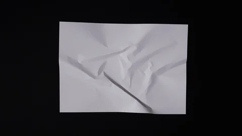 A lump of paper becomes A4 sheet | Stock Video | Pond5