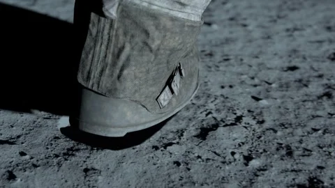 Lunar astronaut walking on the moon's su... | Stock Video | Pond5