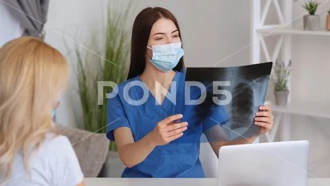 Photograph: Lung radiology chest x-ray doctor examining scan #242399927
