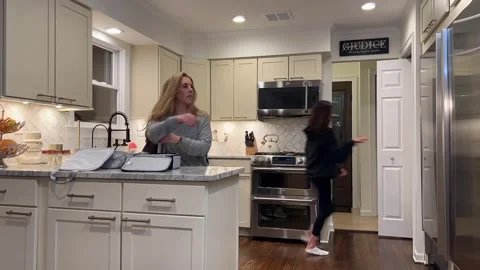 LUX Mom Packing Lunch Boxes for two daug... | Stock Video | Pond5