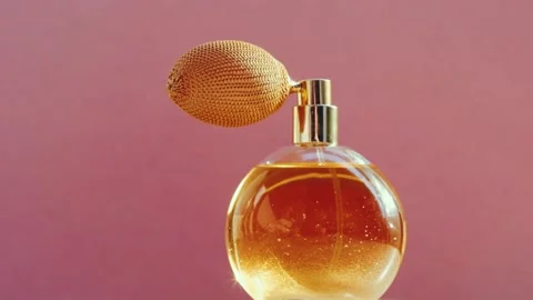 Luxury golden perfume bottle and shining... | Stock Video | Pond5