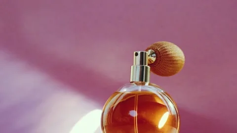 Luxury golden perfume bottle and shining... | Stock Video | Pond5