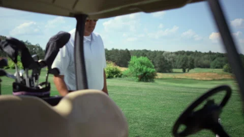 Luxury golf sportsman walking to golfing... | Stock Video | Pond5