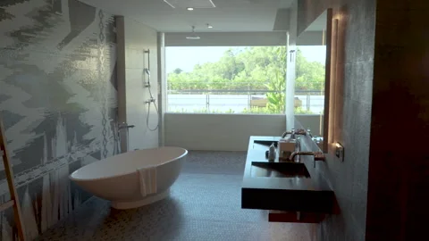 Luxury hotel bathroom vanity with tub an... | Stock Video | Pond5