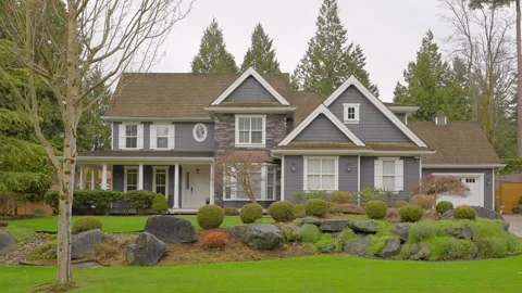 luxury house with big tree and nice land... | Stock Video | Pond5