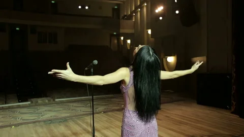 Luxury singer in evening dress performs ... | Stock Video | Pond5