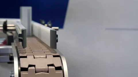 Machine robot hand putting parts on conv... | Stock Video | Pond5