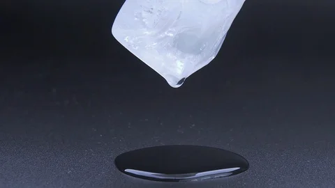 Macro video shooting of melting ice cube... | Stock Video | Pond5