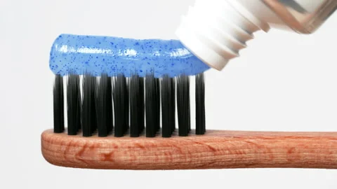 Macro view of toothpaste with toothbrush... | Stock Video | Pond5
