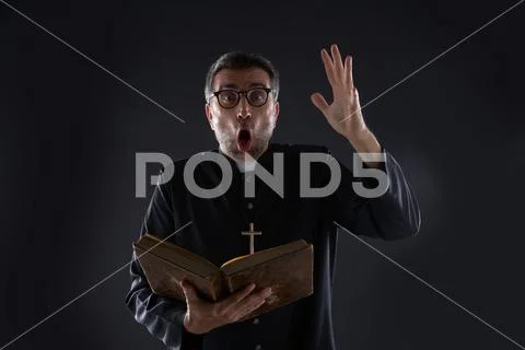 Mad crazy priest surprised expression Stock Image #97241476