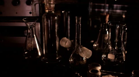 mad scientist lab test tubes skull table | Stock Video | Pond5