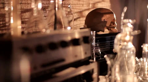 mad scientist lab test tubes skull table | Stock Video | Pond5