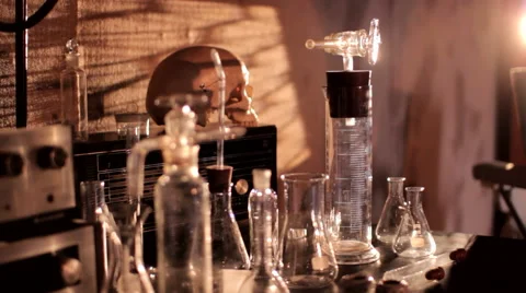 mad scientist lab test tubes skull table | Stock Video | Pond5