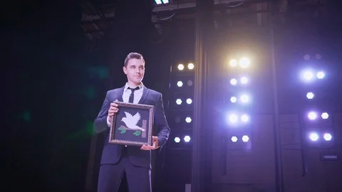 Magic man show trick with white dove at ... | Stock Video | Pond5