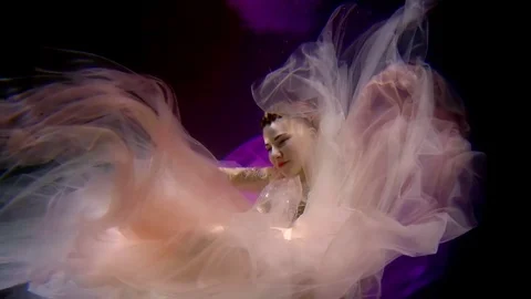 magic nymph is floating in black dark de... | Stock Video | Pond5