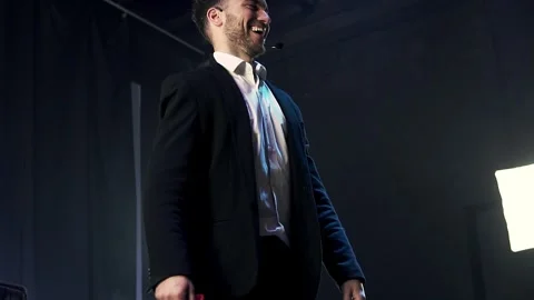 Magician doing a magic show in front of ... | Stock Video | Pond5