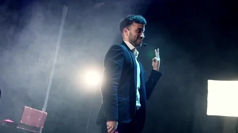 Magician doing a magic show in front of ... | Stock Video | Pond5