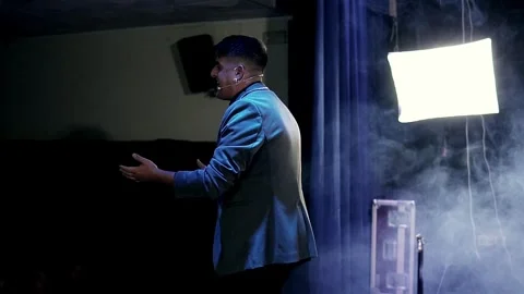 Magician presenter speaking in slow moti... | Stock Video | Pond5