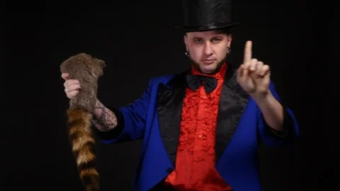 The magician shows tricks on black backg... | Stock Video | Pond5