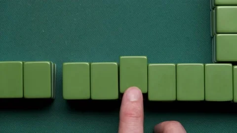 Mahjong game. Man rotate indicator of do... | Stock Video | Pond5