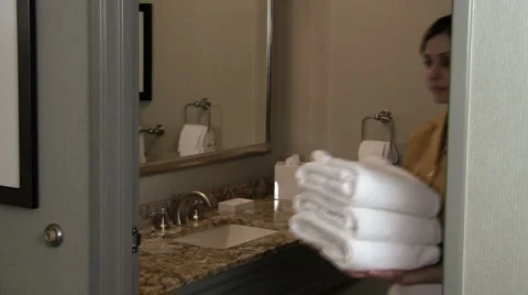 Maid walks in and out of bathroom V3 - H... | Stock Video | Pond5