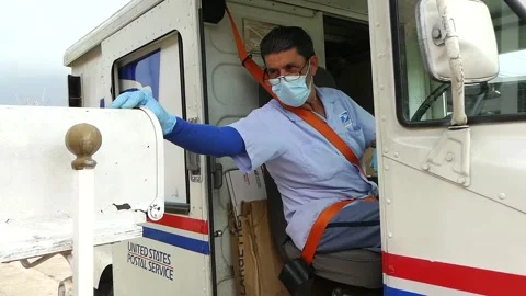 Mailman Inside Mail Truck, with Facemask... | Stock Video | Pond5