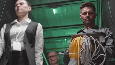 Maintenance Man Standing in Server Room | Stock Video | Pond5