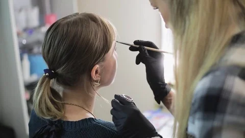 Make-up artist and model. Young blonde. ... | Stock Video | Pond5