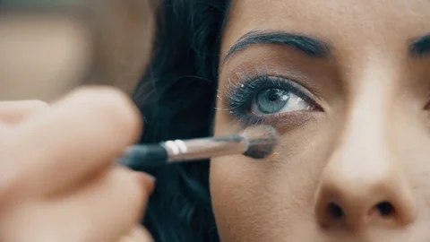 Make-up artist working on beautiful mod... | Stock Video | Pond5