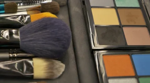 Make up brushes and two make up palettes... | Stock Video | Pond5