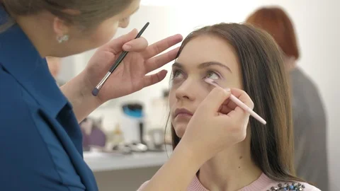 Make up stylist apply color powder on ey... | Stock Video | Pond5