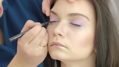 Make up stylist draw color line on eyeli... | Stock Video | Pond5