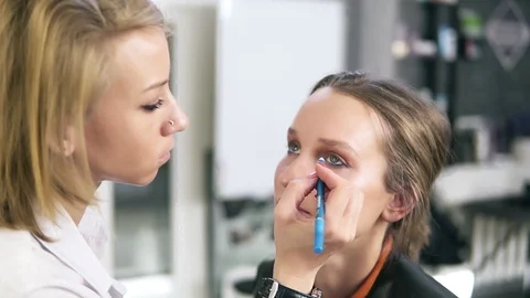 Make-up work. Make-up artist and model. ... | Stock Video | Pond5