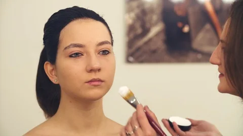 Makeup artist start to draw on the model... | Stock Video | Pond5