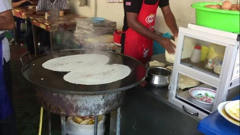 Making Dosa Stock Footage ~ Royalty Free Stock Videos | Pond5