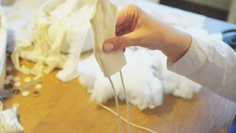 Making of handmade doll. Woman stuffing ... | Stock Video | Pond5