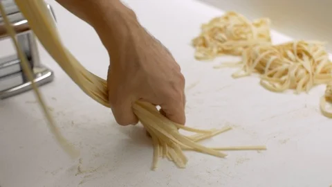 Making Pasta on a Cutting Machine | Stock Video | Pond5