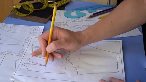 Making sewing pattern templates | Stock Video | Pond5