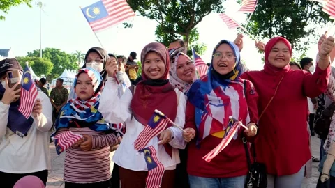 Malaysia people wave Jalur Gemilang flag | Stock Video | Pond5