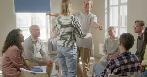 Male and Female Hug Sit in Circle Feel R... | Stock Video | Pond5