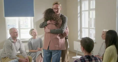 Male and Female Hug Sit in Circle Feel R... | Stock Video | Pond5