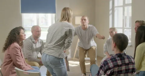 Male and Female Hug Sit in Circle Feel R... | Stock Video | Pond5