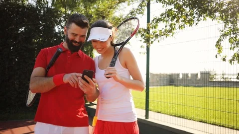 Male and female tennis opponents put off... | Stock Video | Pond5