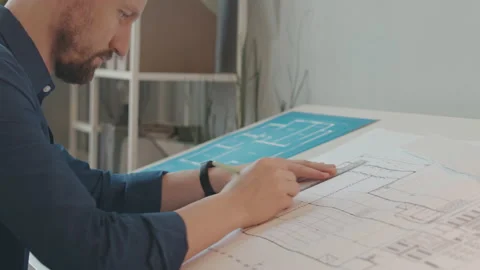 Male Architect Drawing House Plan in Off... | Stock Video | Pond5