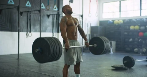 Male athlete performing a power clean in... | Stock Video | Pond5