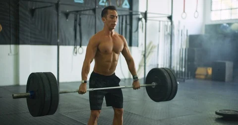 Male athlete performing a power clean in... | Stock Video | Pond5