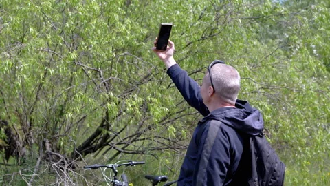 Male with a Backpack is Trying to Catch ... | Stock Video | Pond5